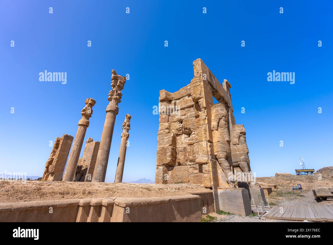 Imposing Lamassu statues stand tall, casting intricate shadows amidst ...