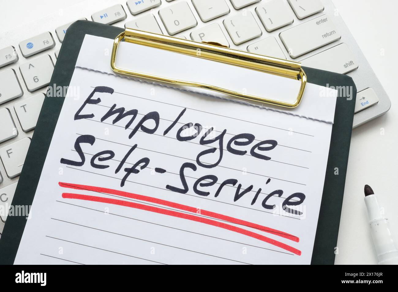 Clipboard with handwritten mark employee self-service Stock Photo - Alamy