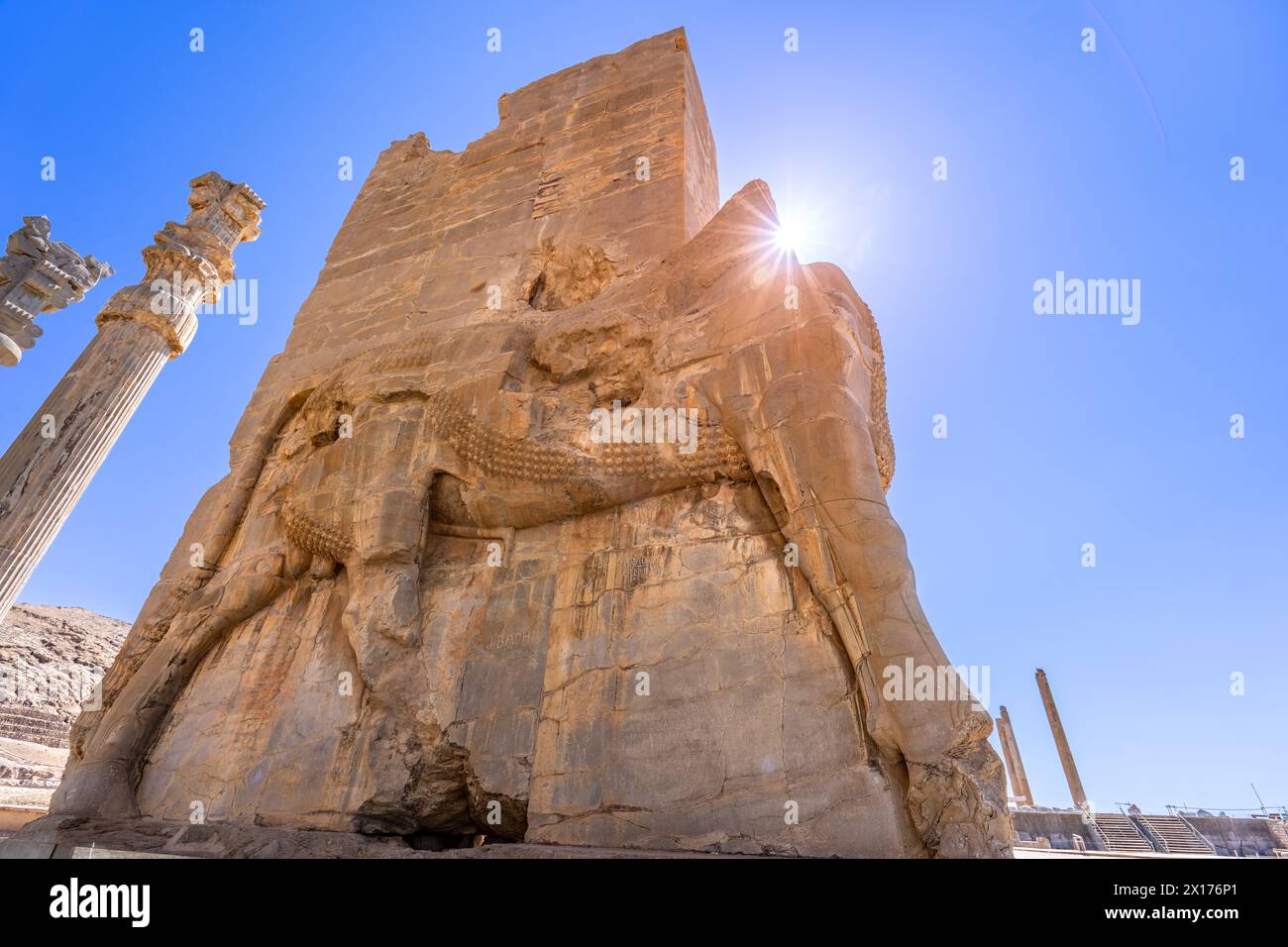 Imposing Lamassu statues stand tall, casting intricate shadows amidst ...