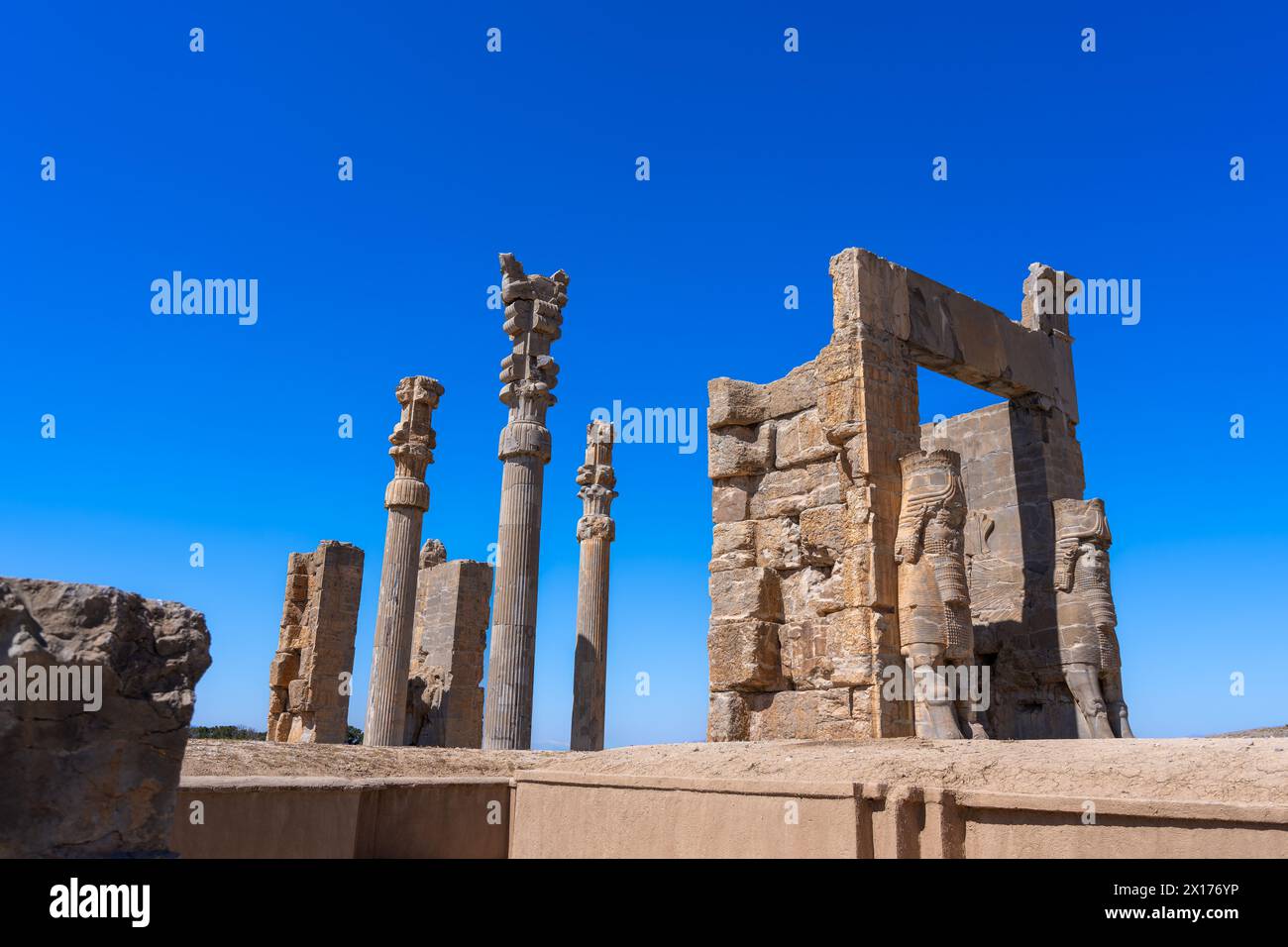 Imposing Lamassu statues stand tall, casting intricate shadows amidst ...