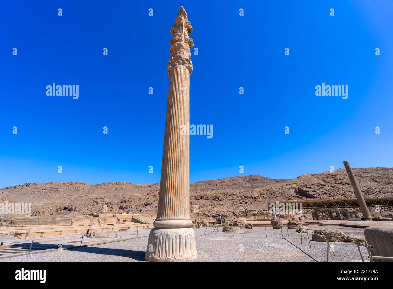 A towering column adorned with intricate carvings stands against the ...