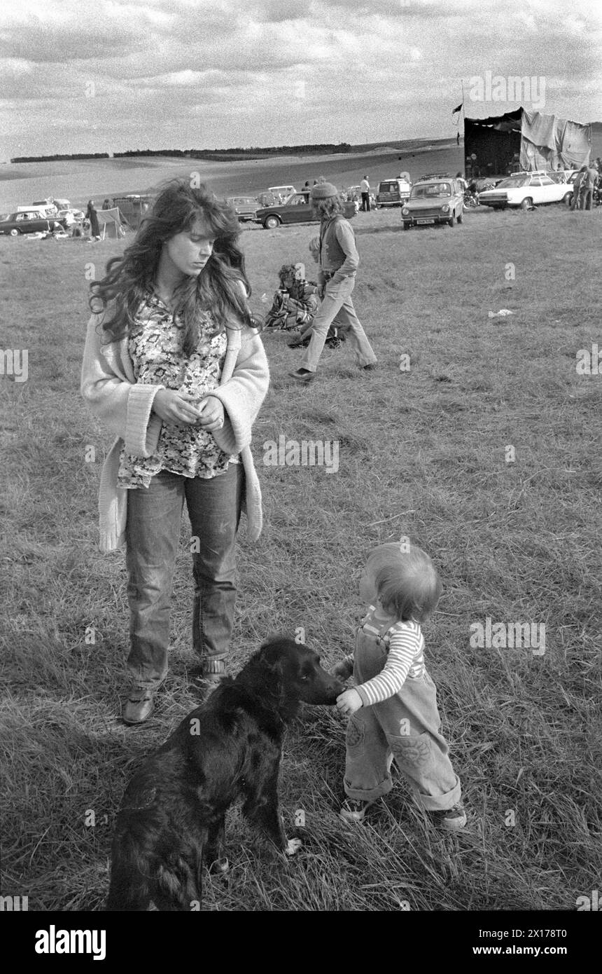 Middle class young mother child and family dog at the summer solstice ...