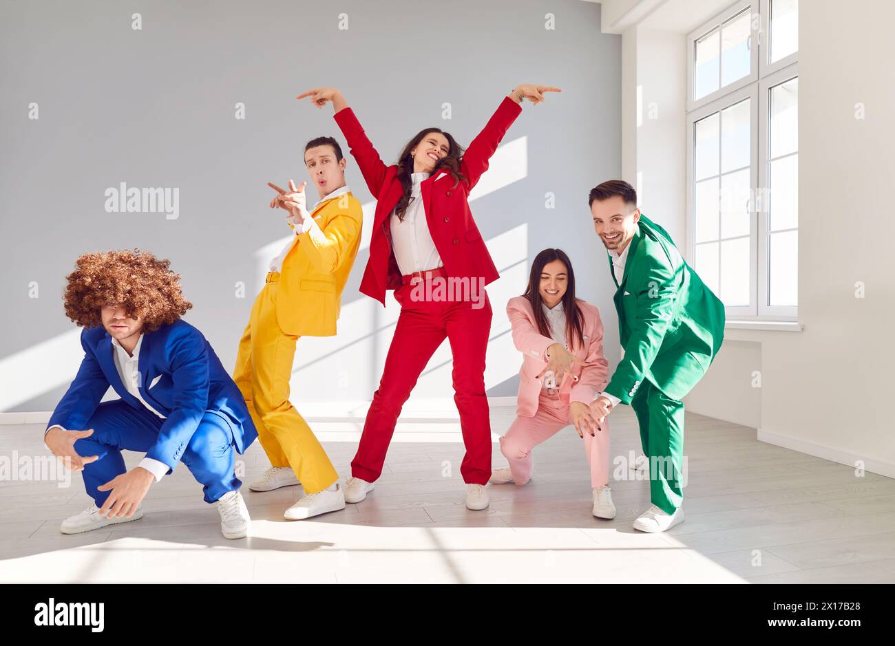 Group Portrait Of Happy Dancers In Colorful Costumes Dancing Together ...