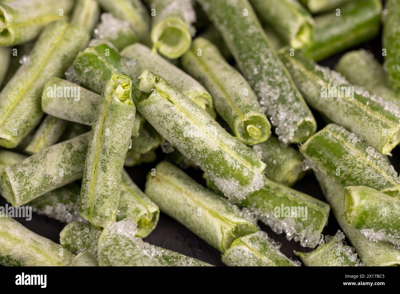 frozen green string beans, deep frozen beans for cooking , close-up ...