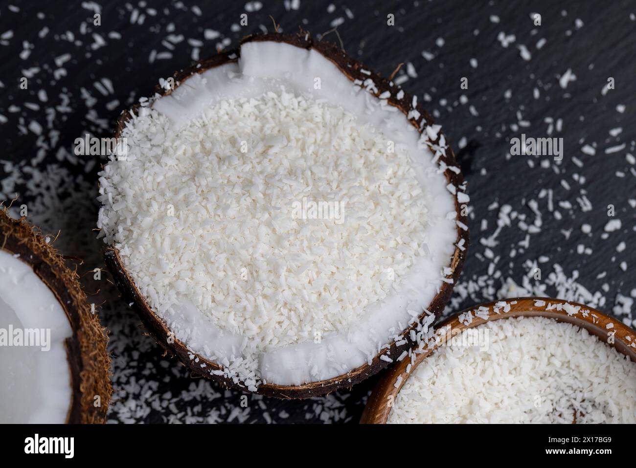 white coconut pulp and dried coconut flakes, a close-up of which is ...