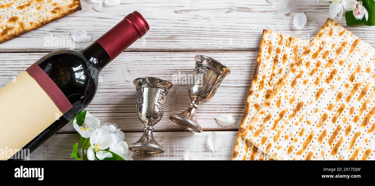 Celebrating Jewish religious holiday of Passover. Bottle of wine, matzo ...