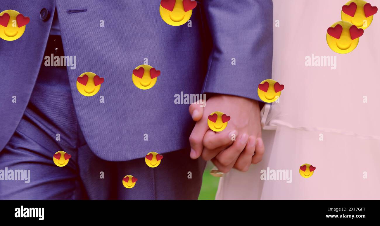 Image of multiple heart eyes face emoji floating against mid section of ...