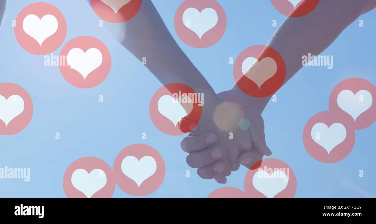 Image of red heart icons floating over mid section of couple in love ...