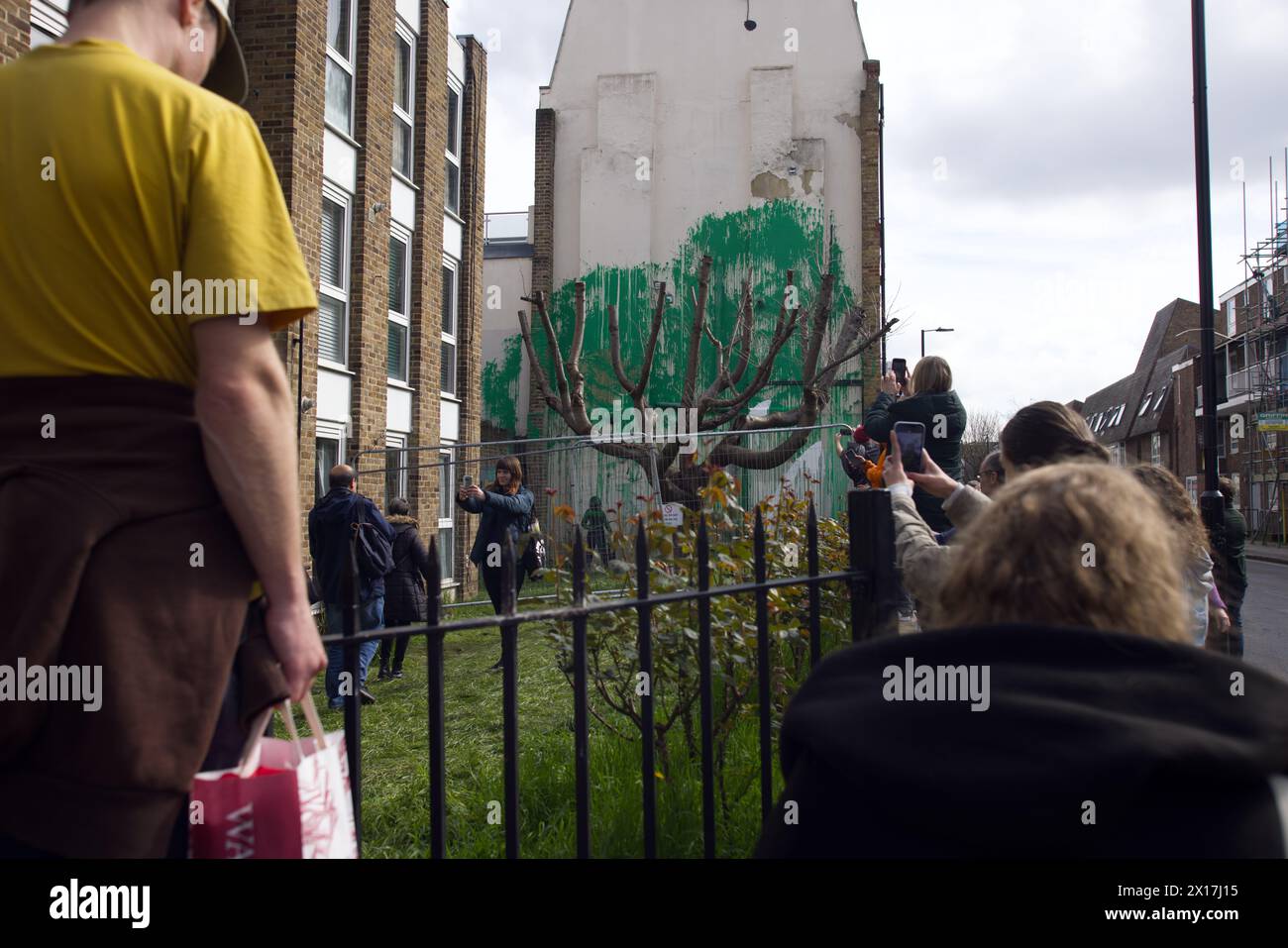 Fenced off Banksy, tree mural, Hornsey Road, North London Stock Photo ...