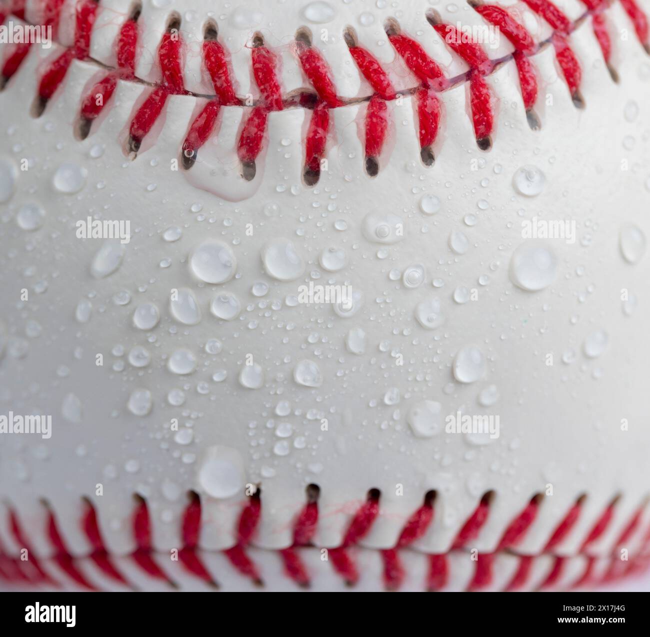 white baseball ball tied with red thread, a real round baseball ball ...