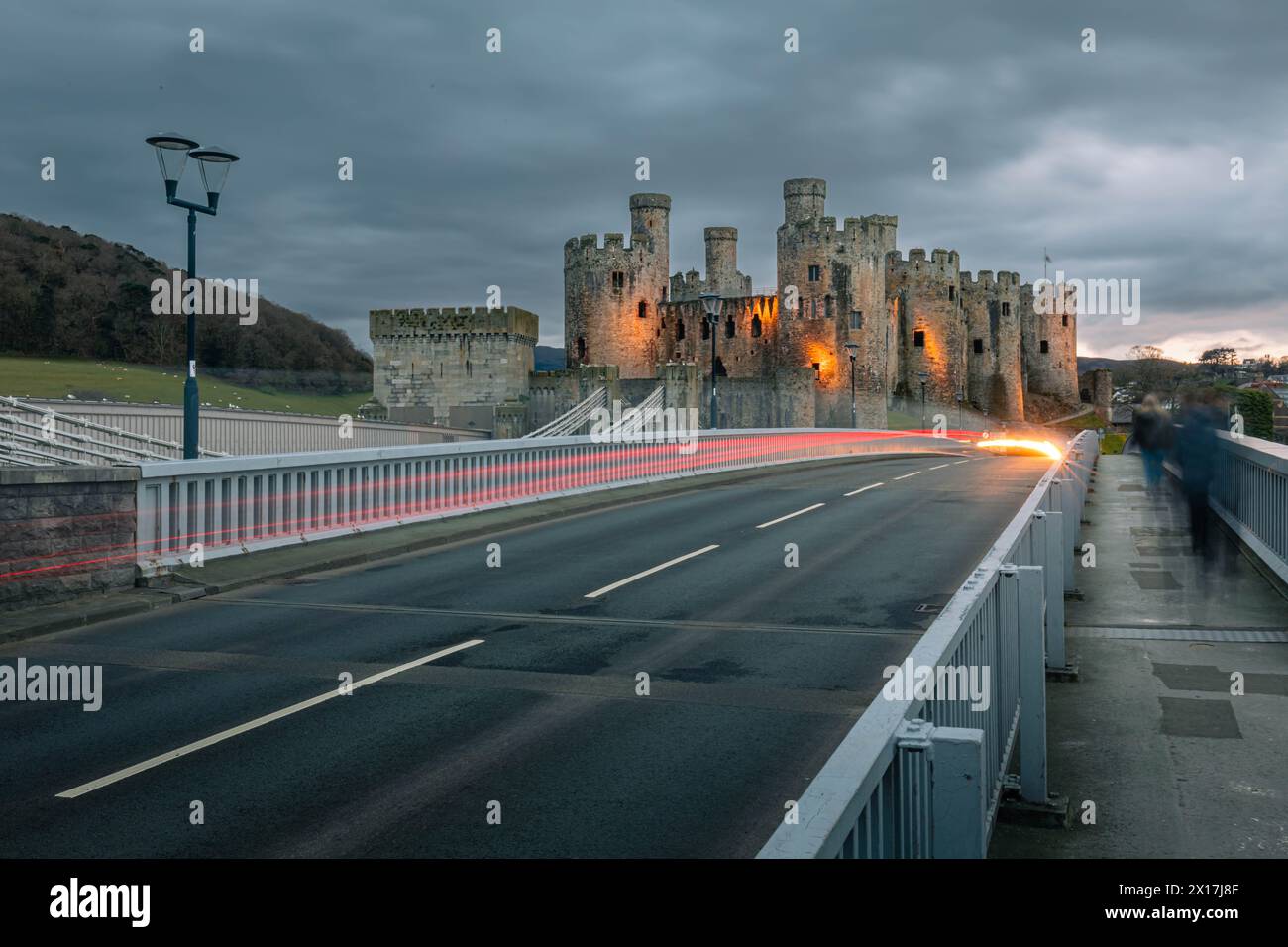 Conway Castle (Castell Conwy) North Wales, with car lights moving ...