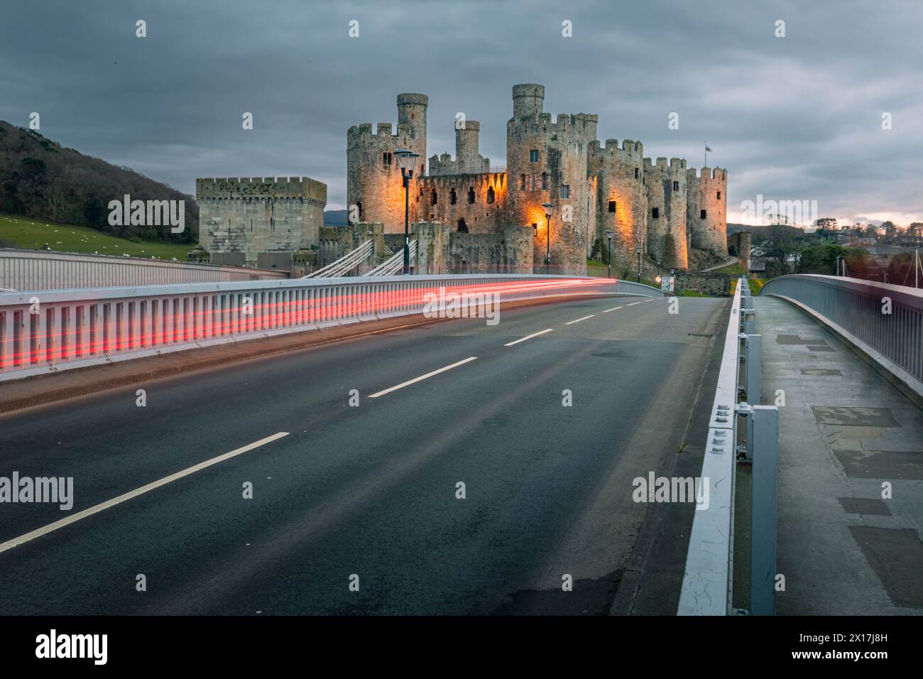 Conway Castle (Castell Conwy) North Wales, with car lights moving ...