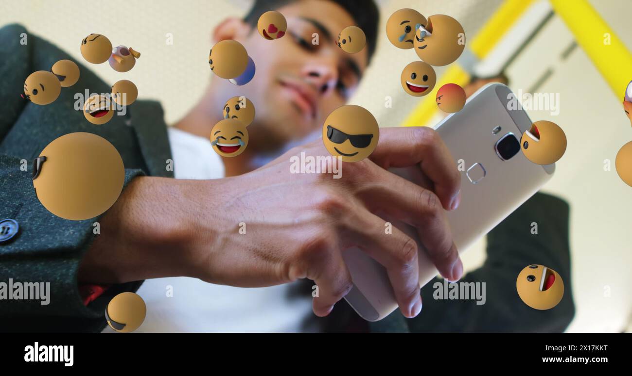 The image features a young male commuter using his mobile phone while ...