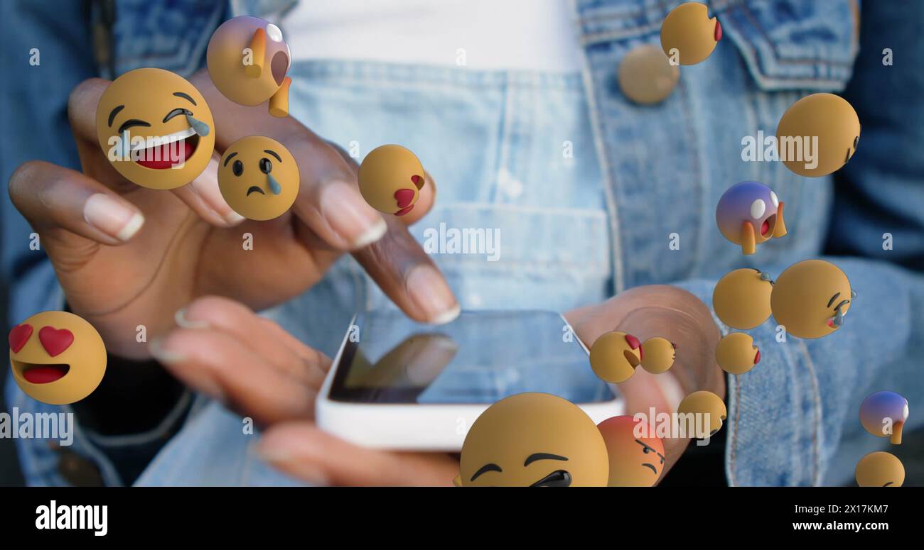 Image of multiple face emojis floating over mid section of a woman ...