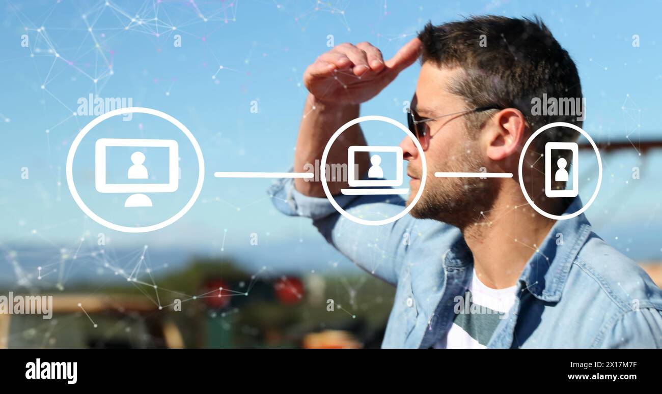 Image of connections with icons over caucasian man using smartphone ...