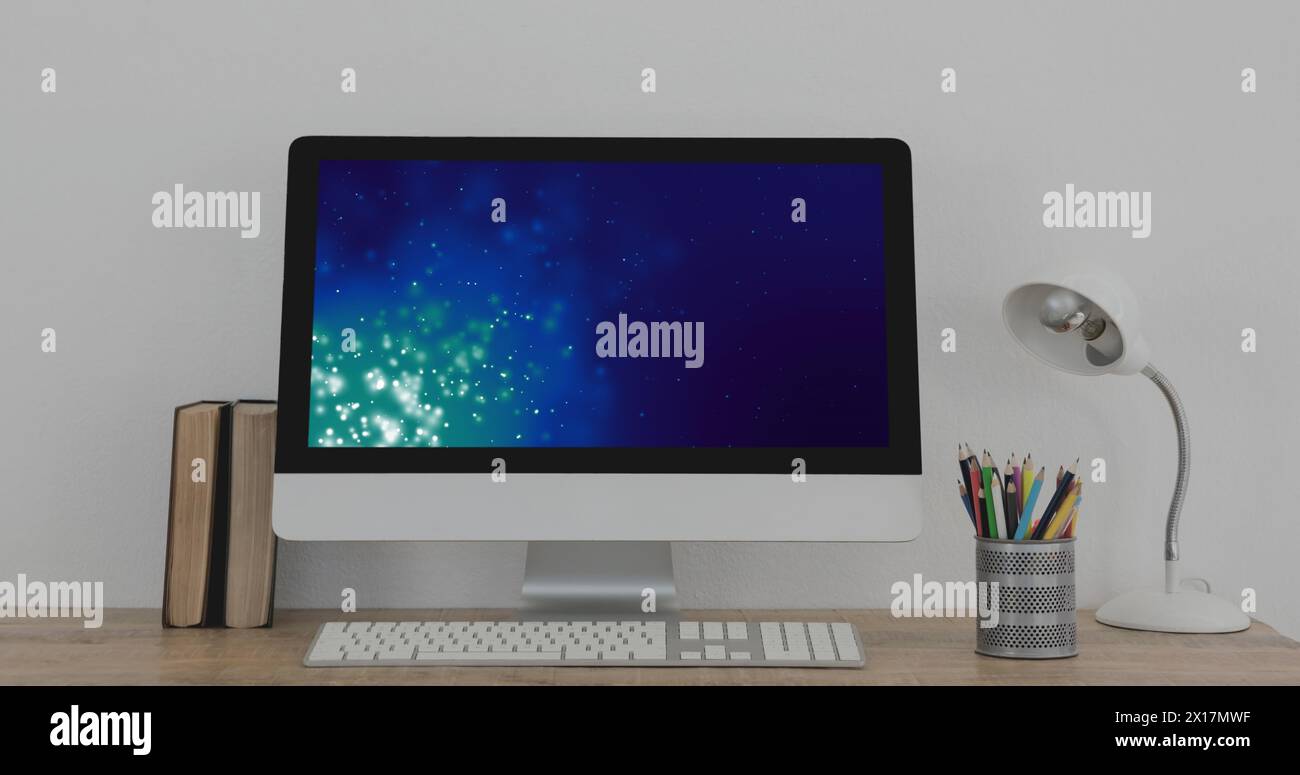 Image of laptop with light trails on screen on desk Stock Photo - Alamy