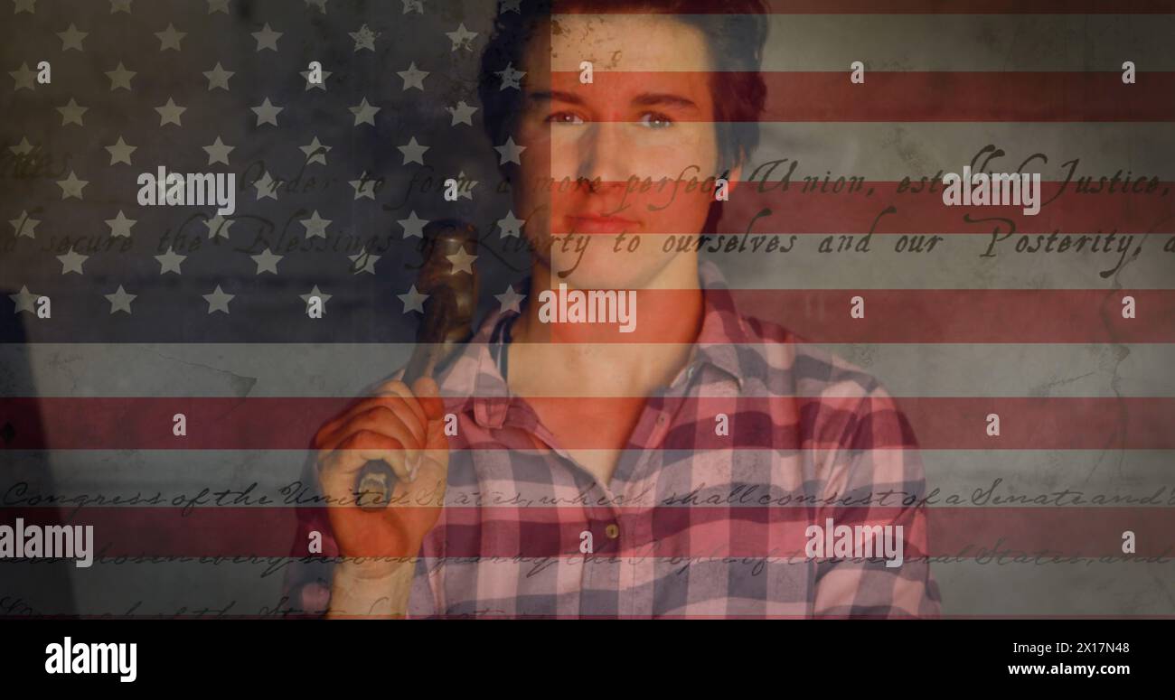 Image of American flag waving over portrait of man holding hammer in ...
