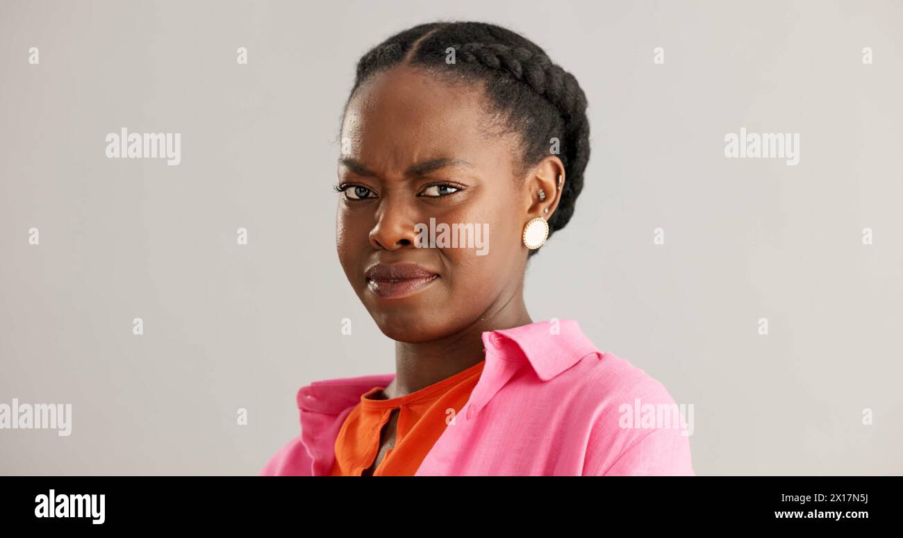 Woman, african and face with studio, disgust and cringe with reaction ...