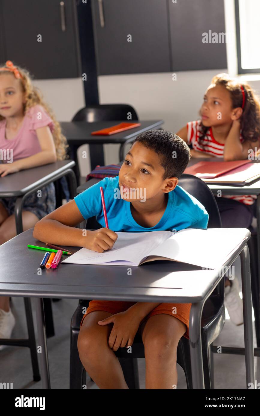 Black Student Sitting At Desk