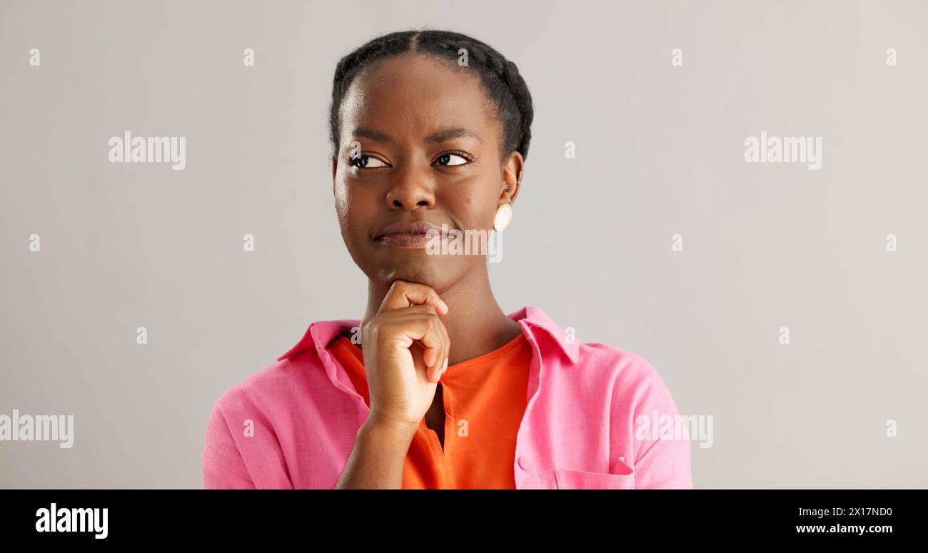 Smile, thinking and black woman in studio with idea, solution or ...