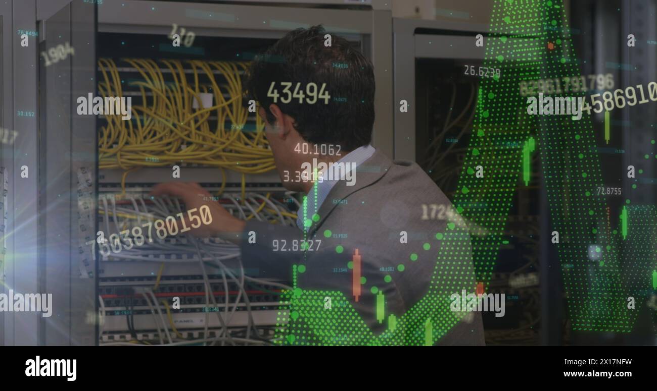 Financial Data Processing Against Caucasian Male Engineer Working In Computer Server Room Stock