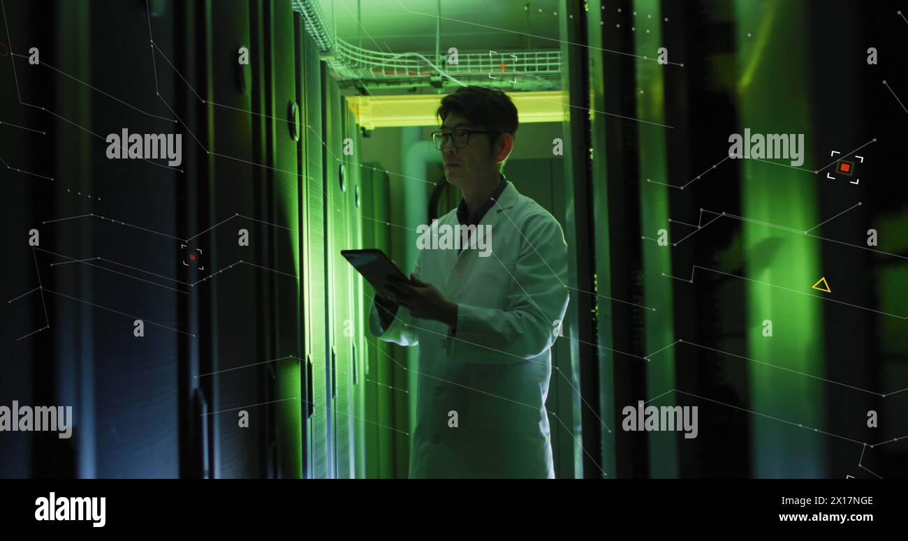 Data processing against asian male engineer with digital tablet working ...