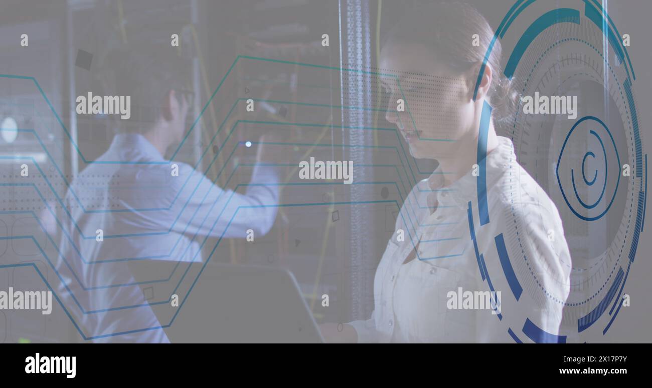 Image of retina round scanner against diverse male and female engineers working at server room ...