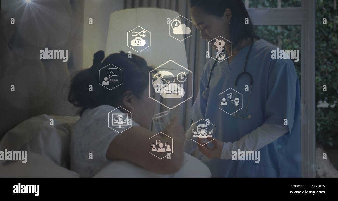 Image of icon in hexagons rotating over female asian doctor helping ...