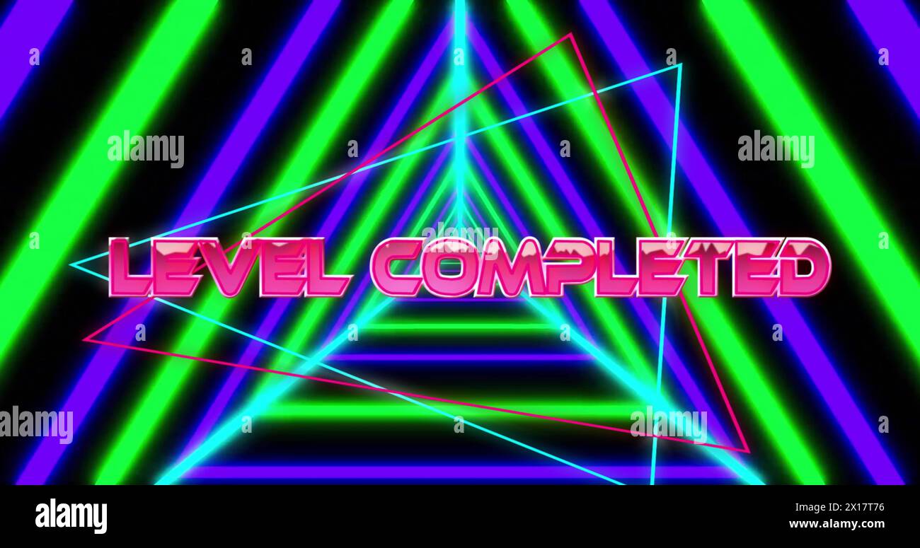 Image of level completed text over neon pattern Stock Photo - Alamy