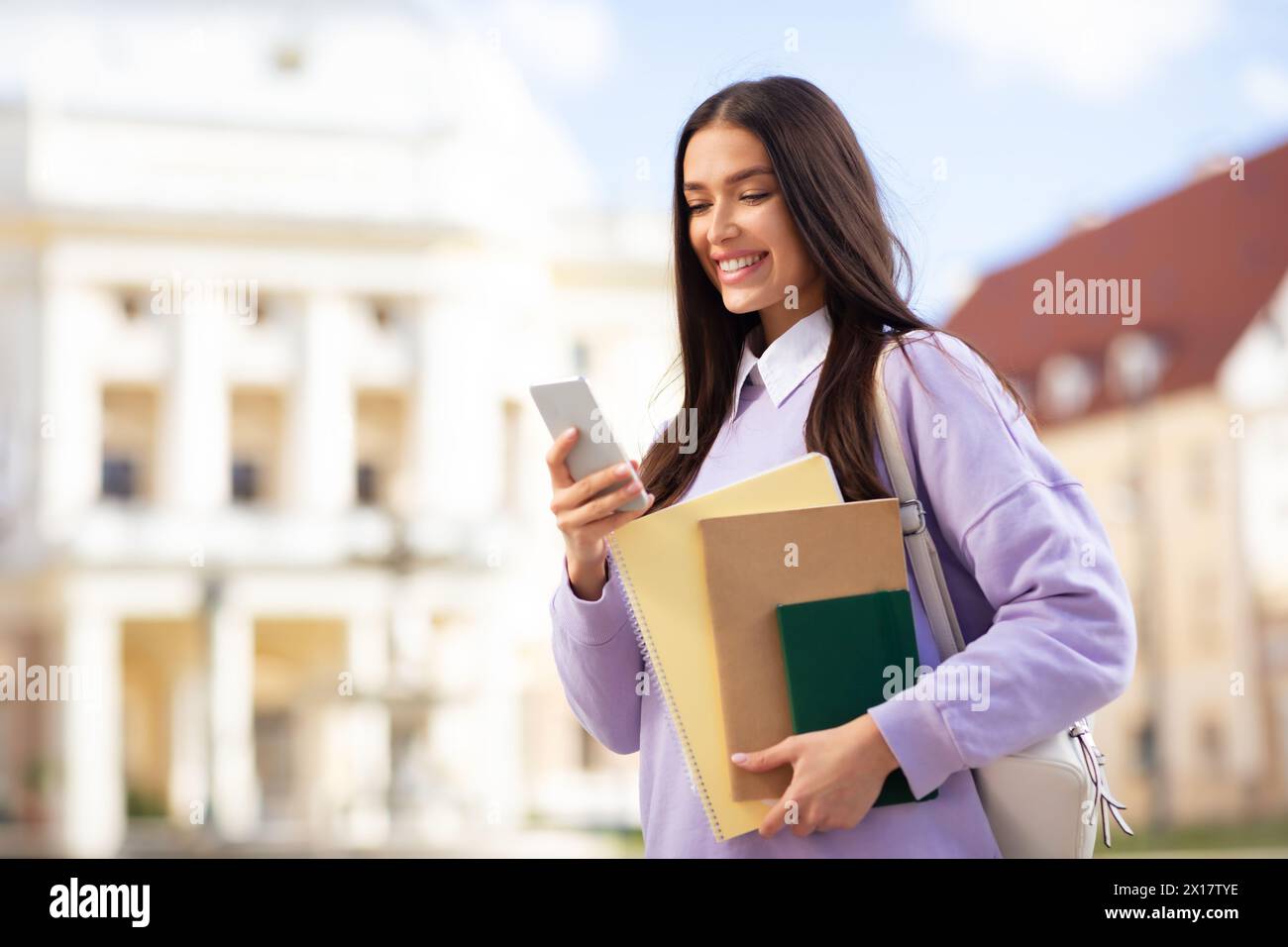 Standing student smiling building exterior architecture hi-res stock ...