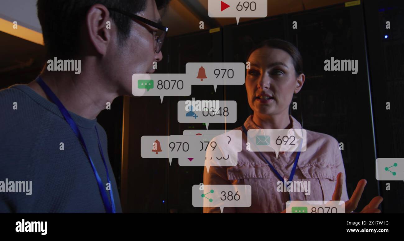 Image of notification bars over diverse coworkers discussing on laptop ...