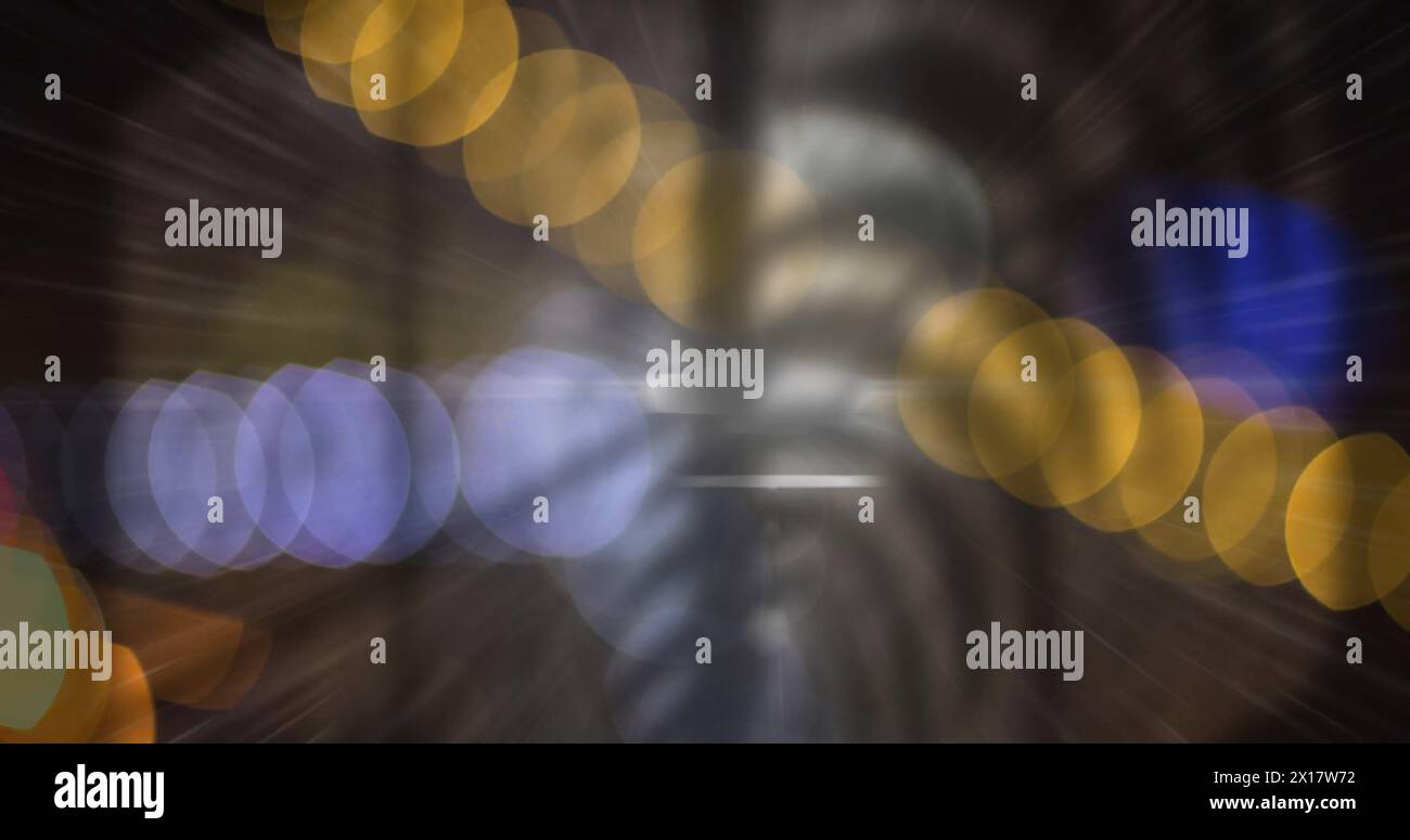 Image of orange and purple light orbs moving left and right over dark ...