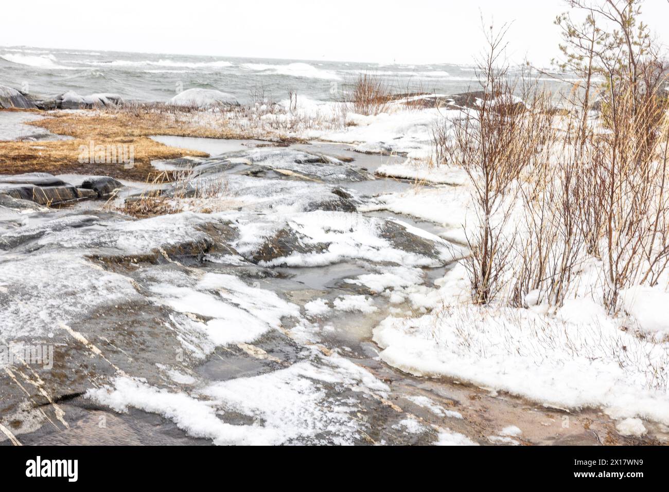 nordic landscape with snow, sweden, water, ice beach and shore Stock ...