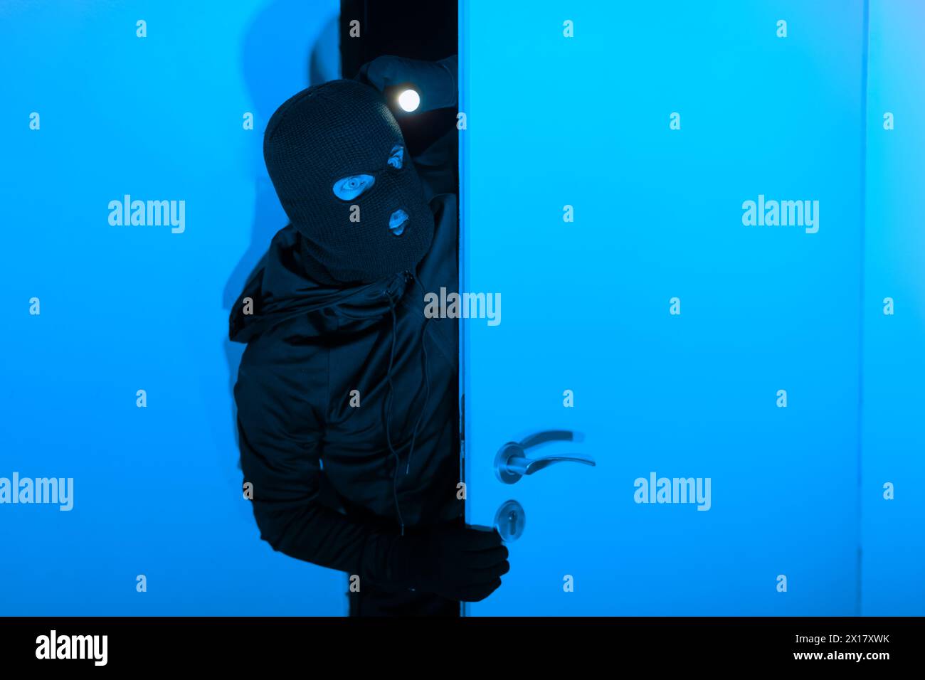 Peeking through door night hi-res stock photography and images - Alamy