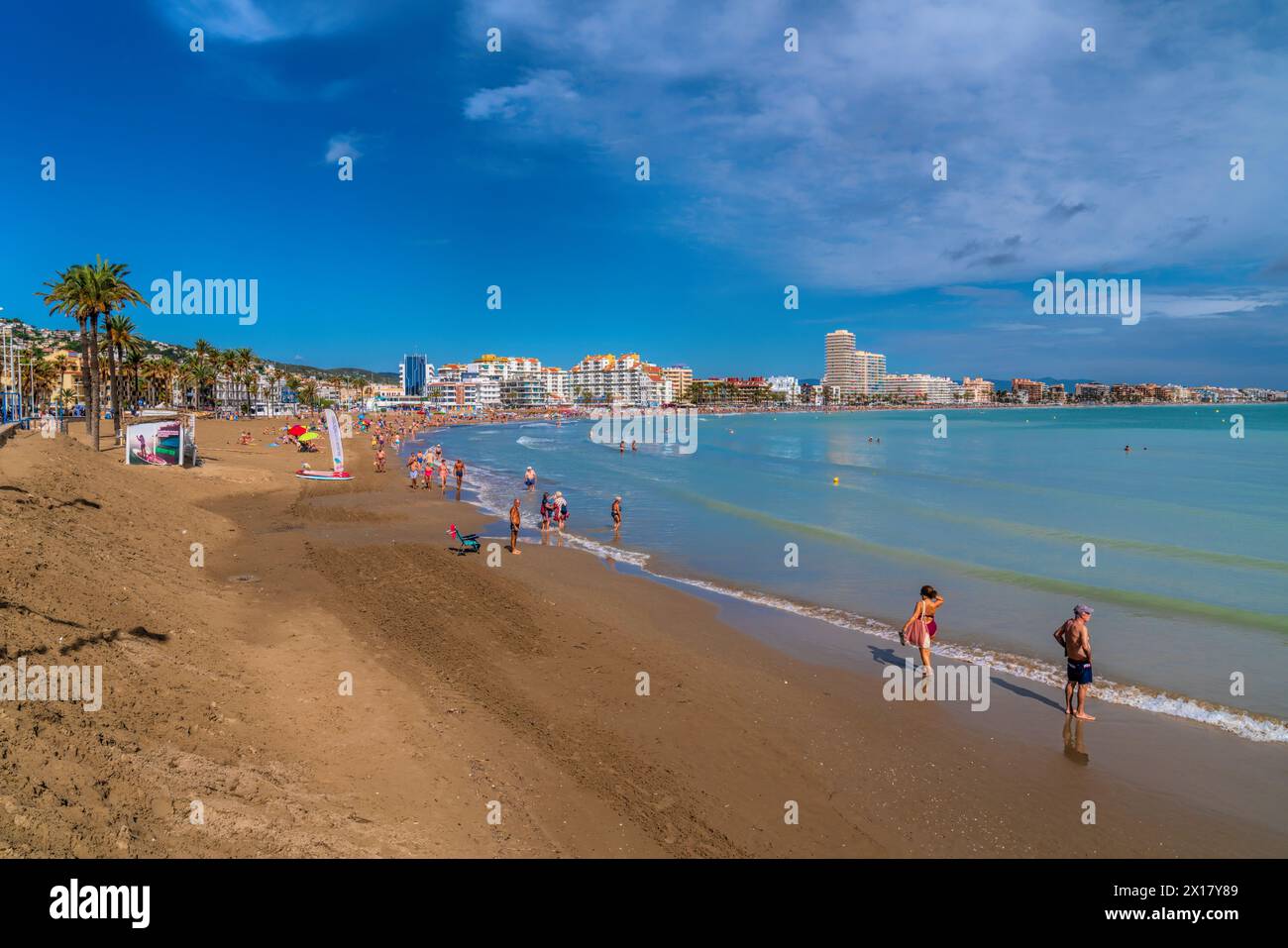 Beach and seafront with blue sky and sunshine Spanish town of Peniscola ...