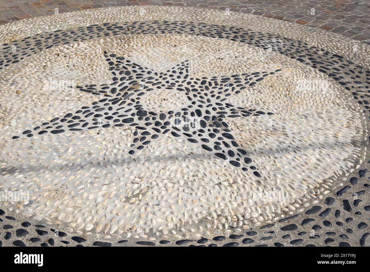 Greek pebble mosaic on the street in Nikia village. Nisyros island ...