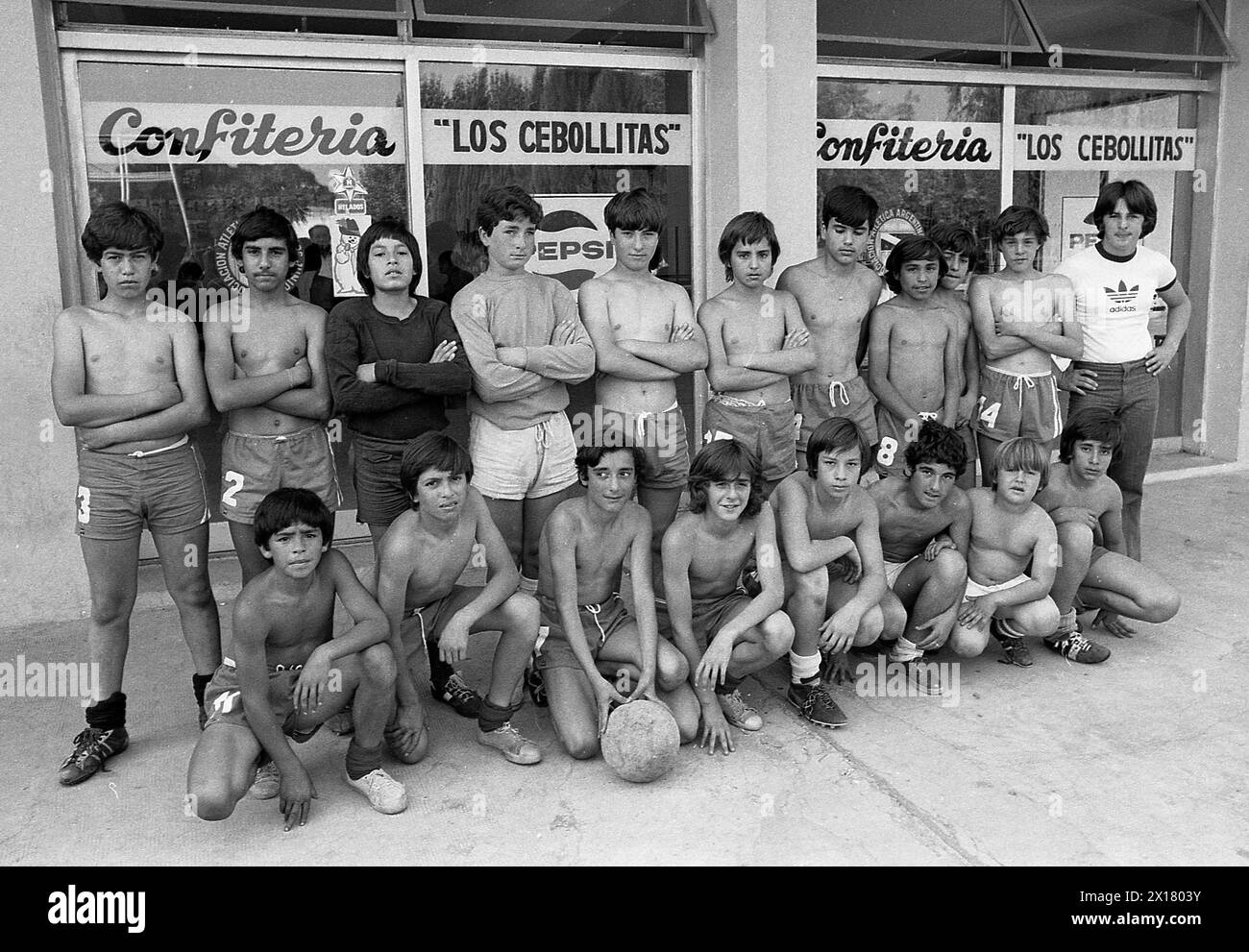 Argentine footballer Diego Armando Maradona (kneeled, left) is a young ...