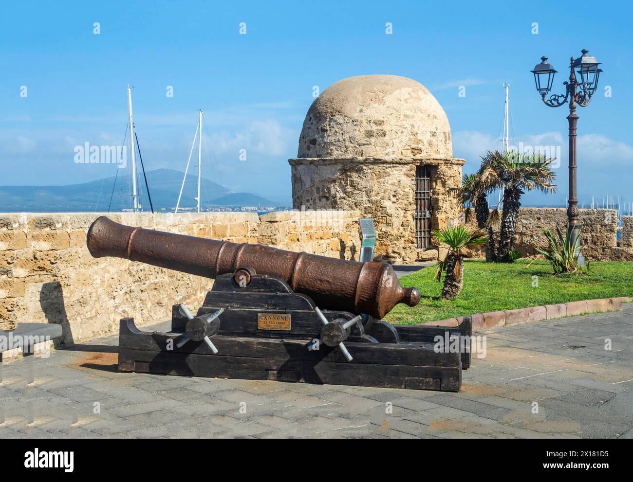Medieval cannon with watchtower at fortress wall of Alghero, Sardinia ...