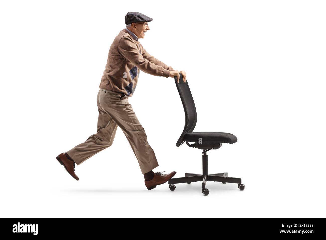 Excited elderly man pushing an office chair isolated on white ...
