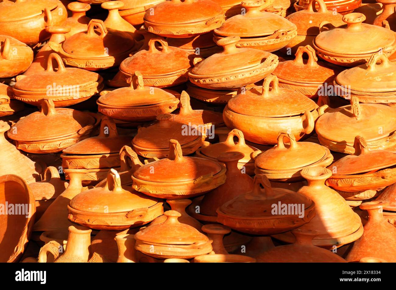 Chefchaouen, pile of terracotta pots at a traditional market ...