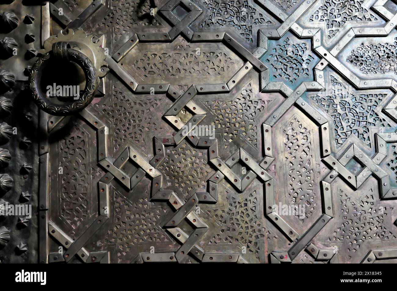 Meknes, Heavy metal door with complex geometric patterns and ...