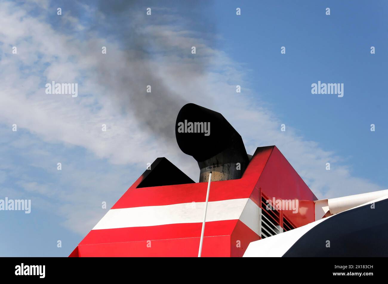 Tangier, Smoking ship chimney with red and white colouring against blue ...