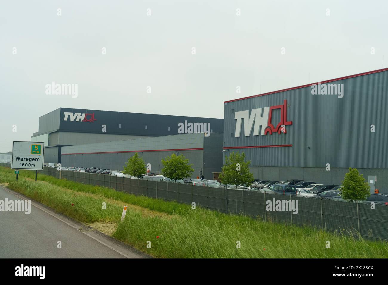 Kortrijk, Belgium - May 22, 2023:The grey facade of the TVH warehouse ...