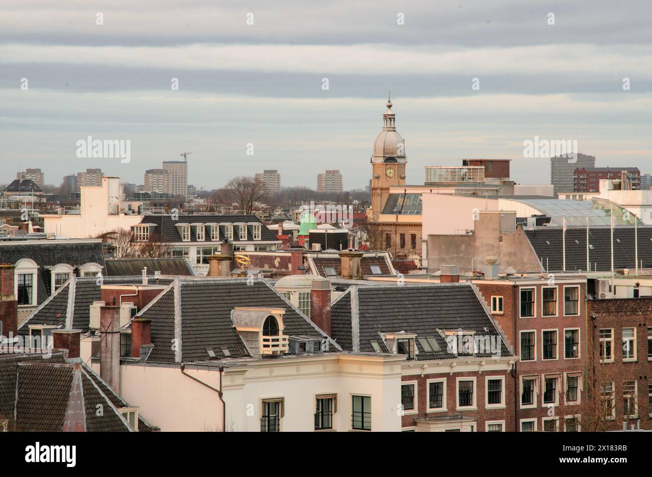 Cityscape of Amsterdam with clock tower in distance Stock Photo - Alamy