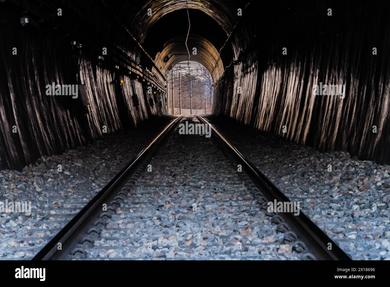 Perspective of the inside of a railroad tunnel with the track extending ...