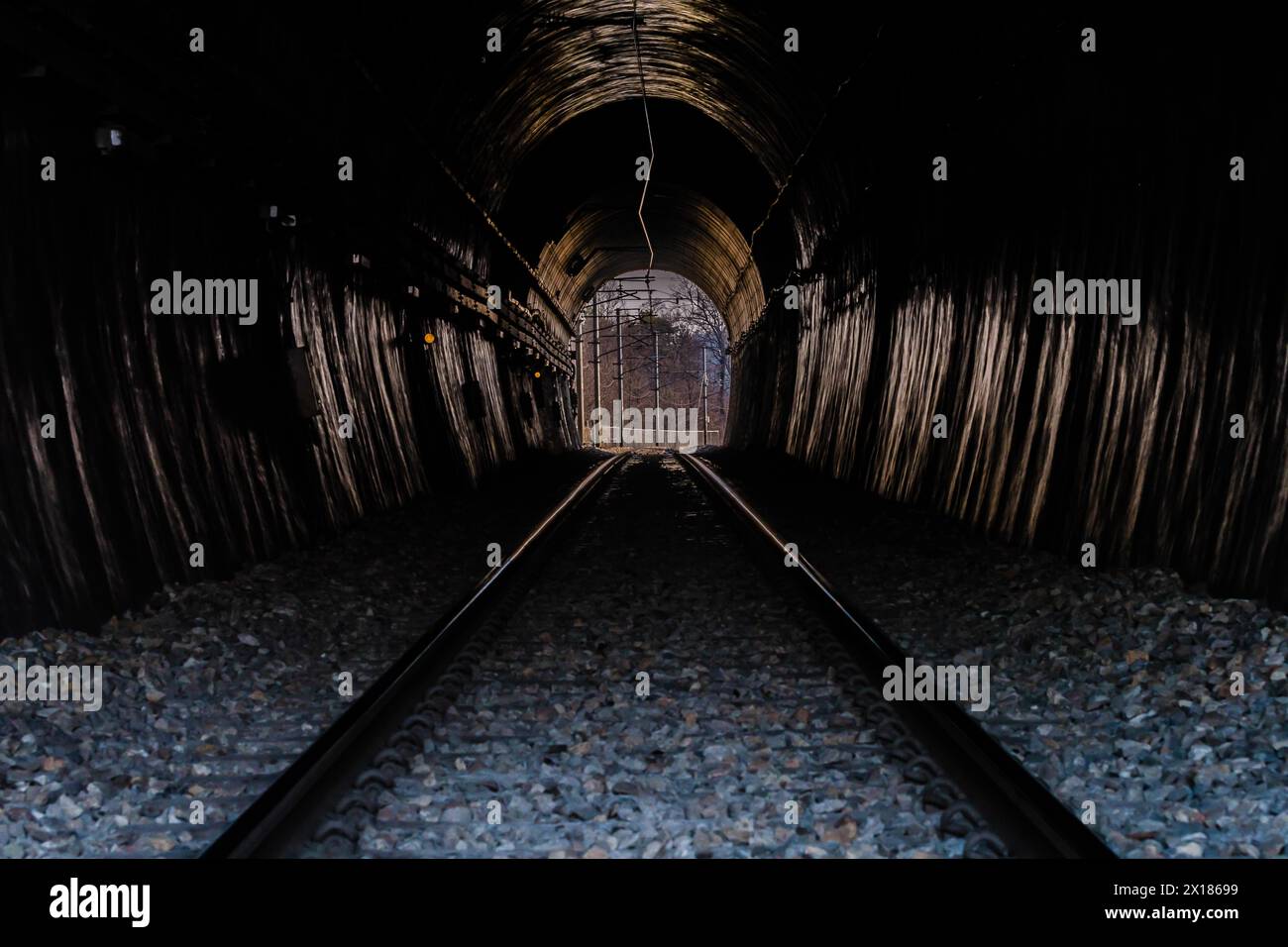 Perspective of the inside of a railroad tunnel with the track extending ...