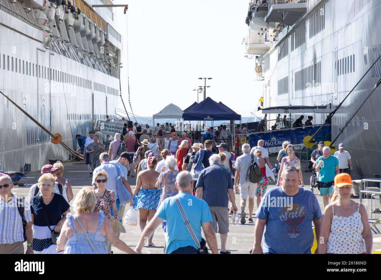 Cruise passengers leaving and returning to cruise ships in Caribbean ...