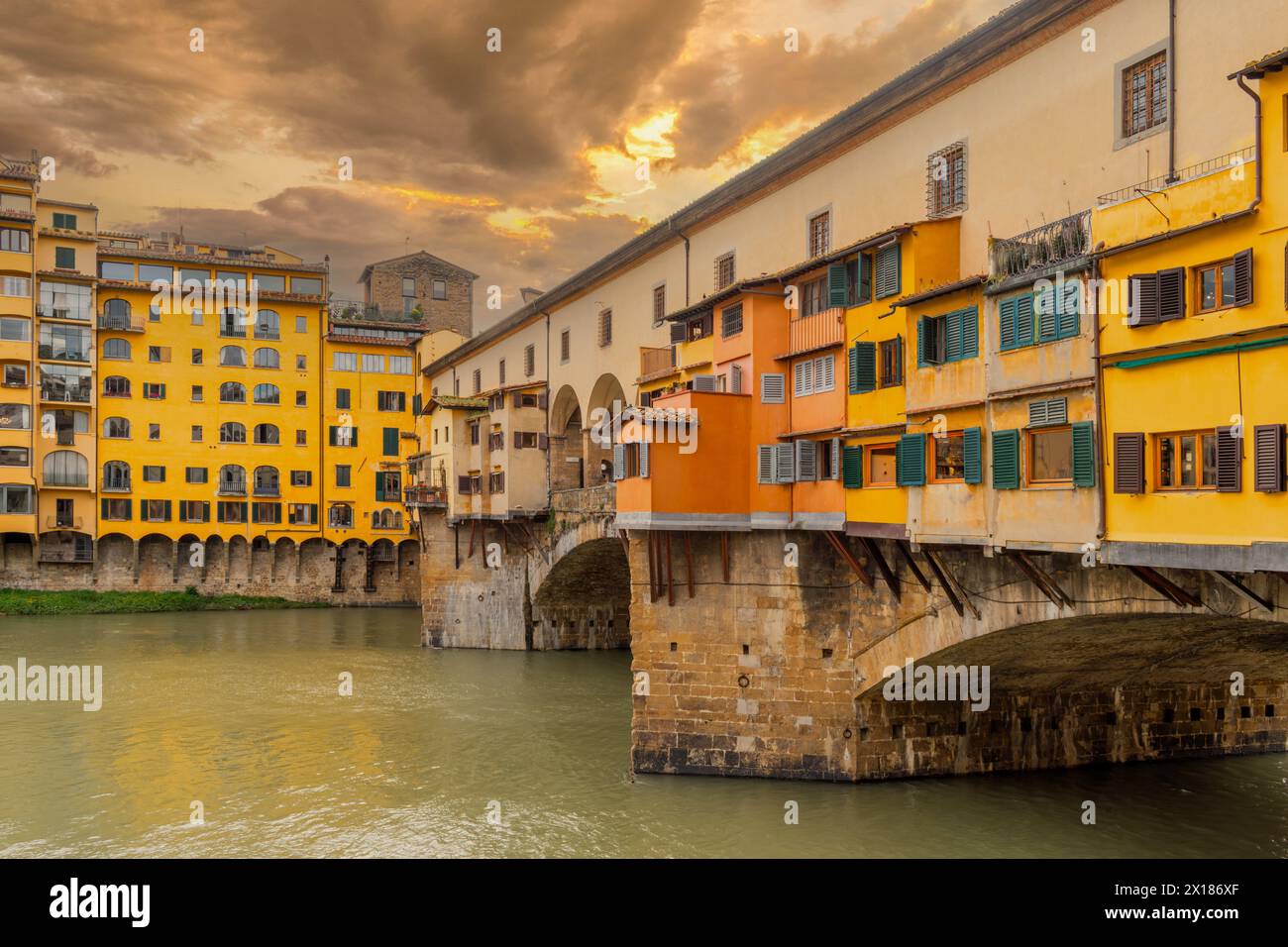 Ponte Vecchio bridge in Florence, Italy, with sunset sky. Medieval ...