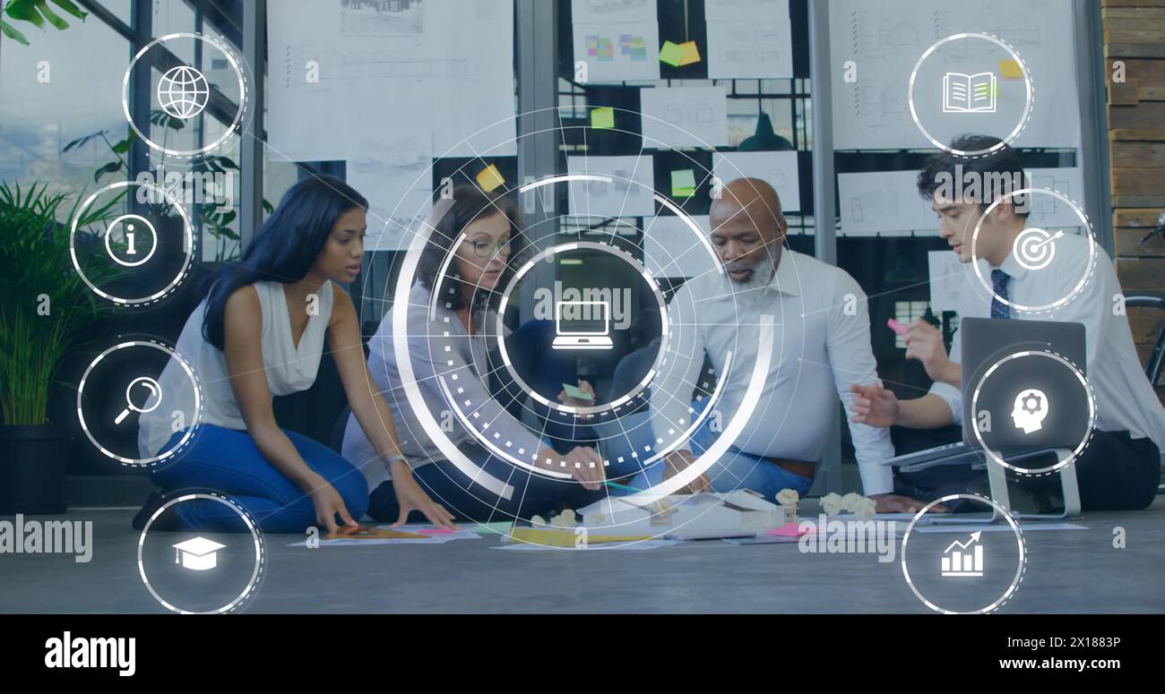 Image of network of digital icons against diverse colleagues discussing ...