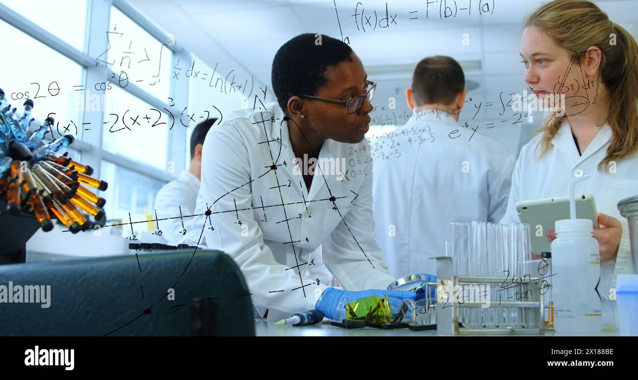 Image of mathematical equations over group of diverse scientists in lab ...